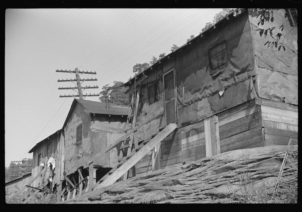Shacks inhabited es, along river | Free Photo - rawpixel