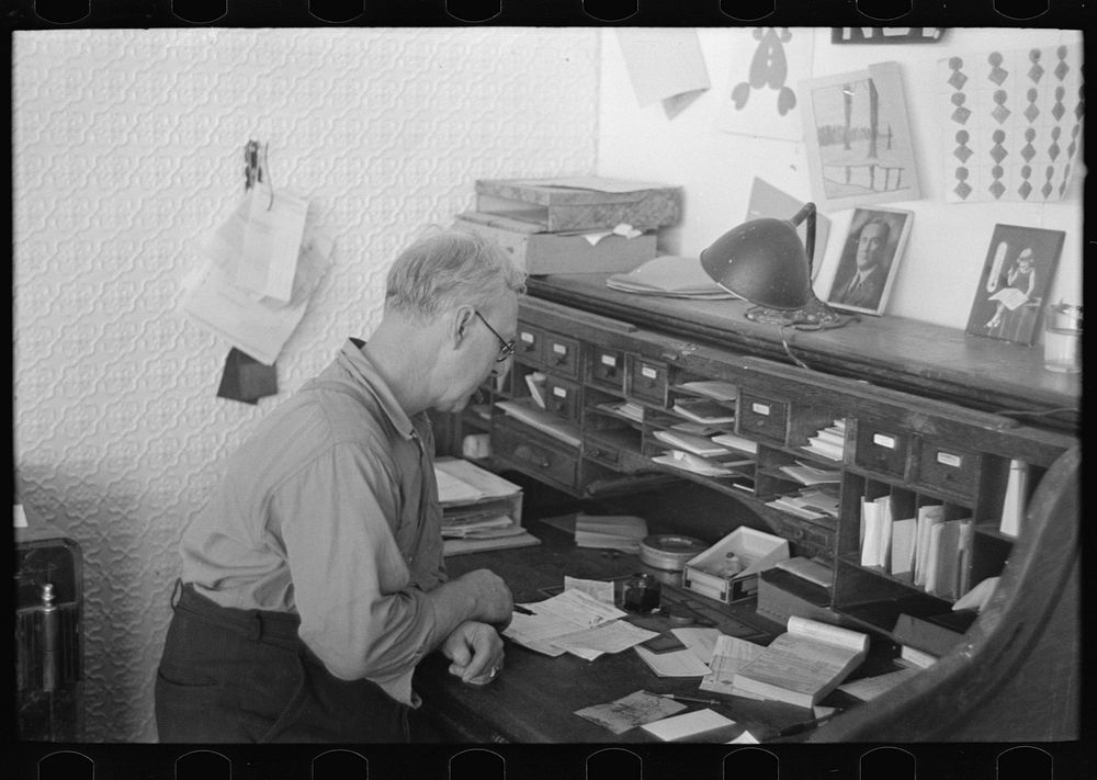 General storekeeper looking bill, Ericsburg, | Free Photo - rawpixel