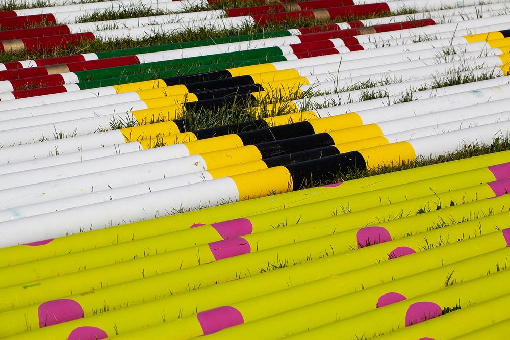 Coloured poles on grass | Free Photo - rawpixel