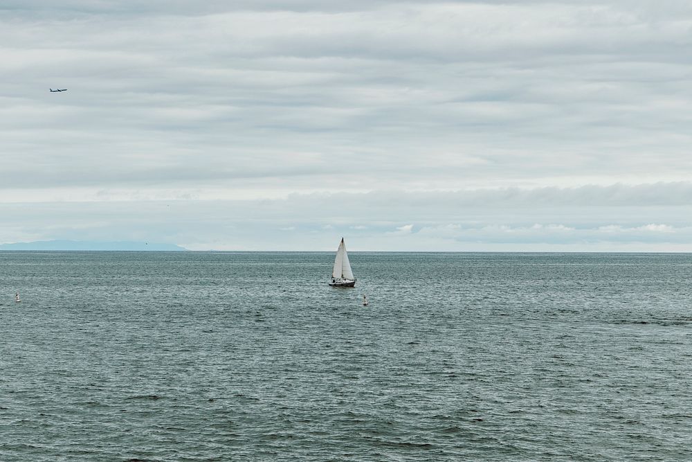 Sailboat sea and plane sky | Premium Photo - rawpixel