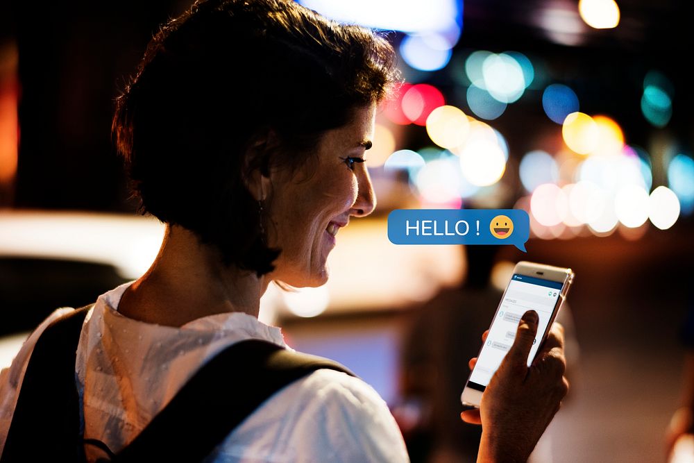 Happy woman texting walking night | Premium Photo - rawpixel