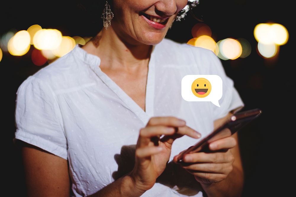 Happy woman texting at night | Premium Photo - rawpixel