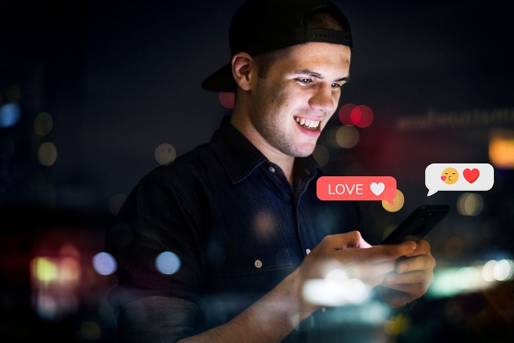 Cheerful young man texting his | Premium Photo - rawpixel