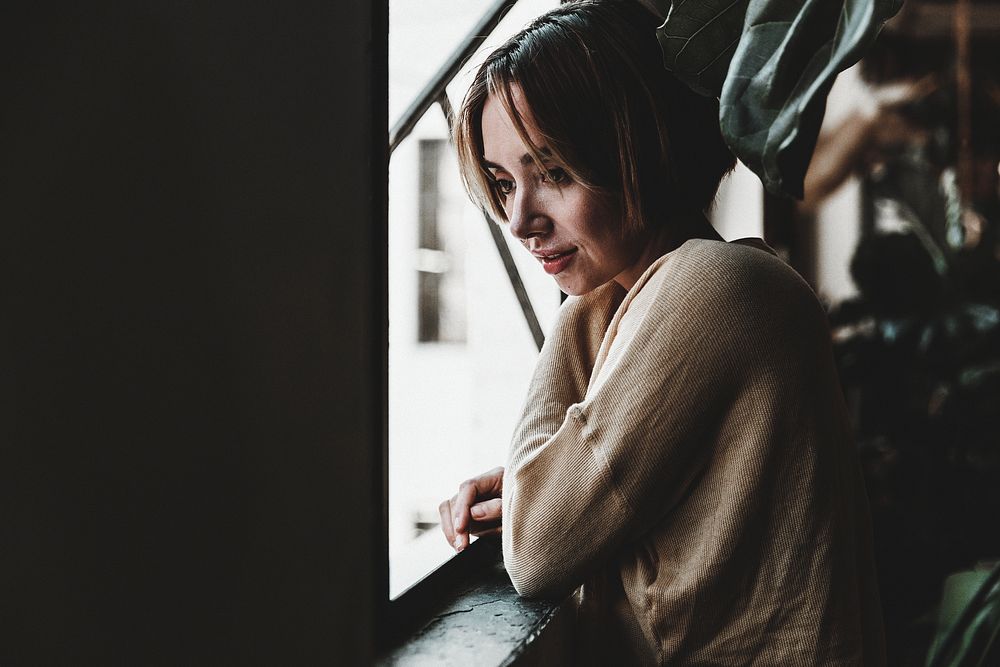 Beautiful woman by a window | Premium Photo - rawpixel
