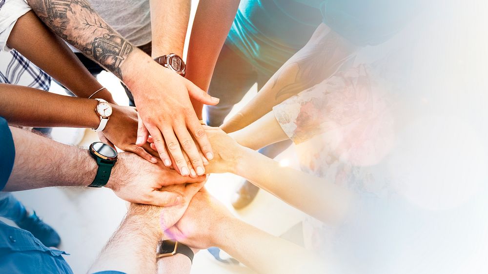 Diverse creative team stacking hands | Premium Photo - rawpixel