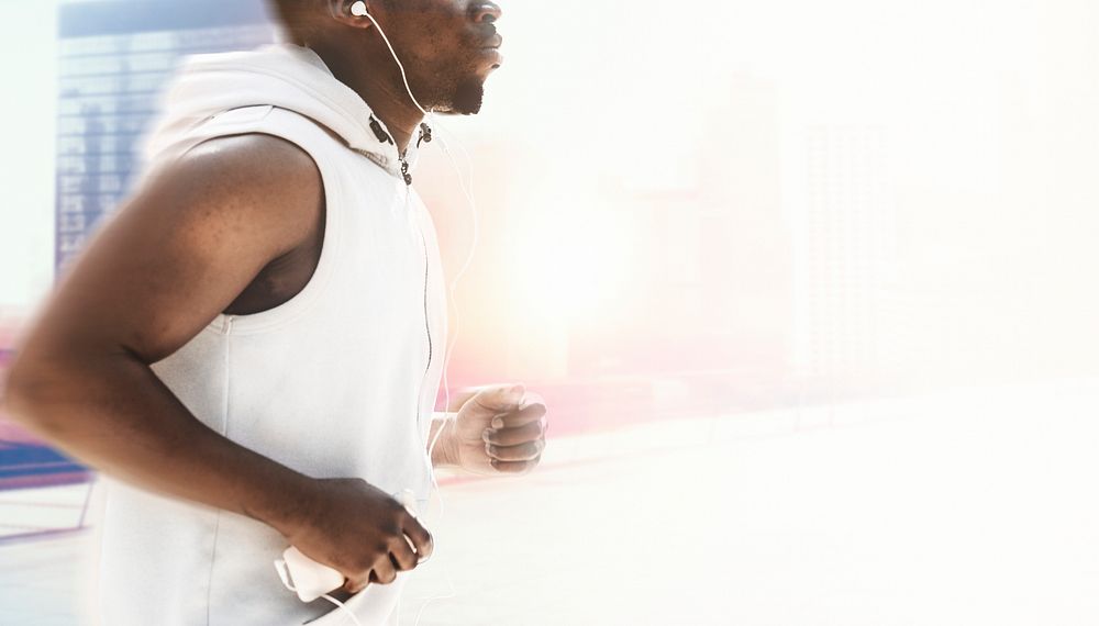 Athletic man running with earphones | Premium Photo - rawpixel