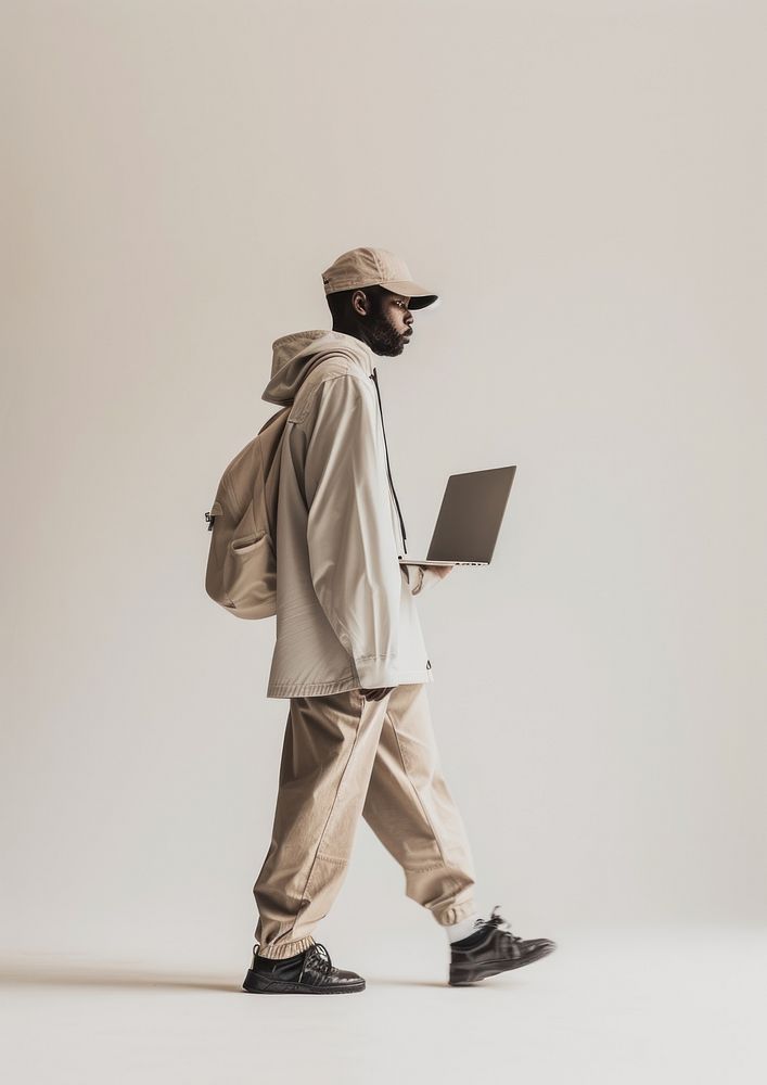 Person holding laptop walking photography | Premium Photo - rawpixel