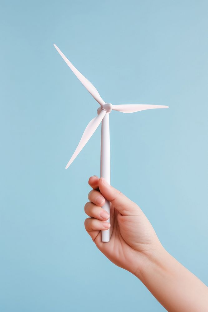 Wind turbine hand machine holding | Free Photo - rawpixel
