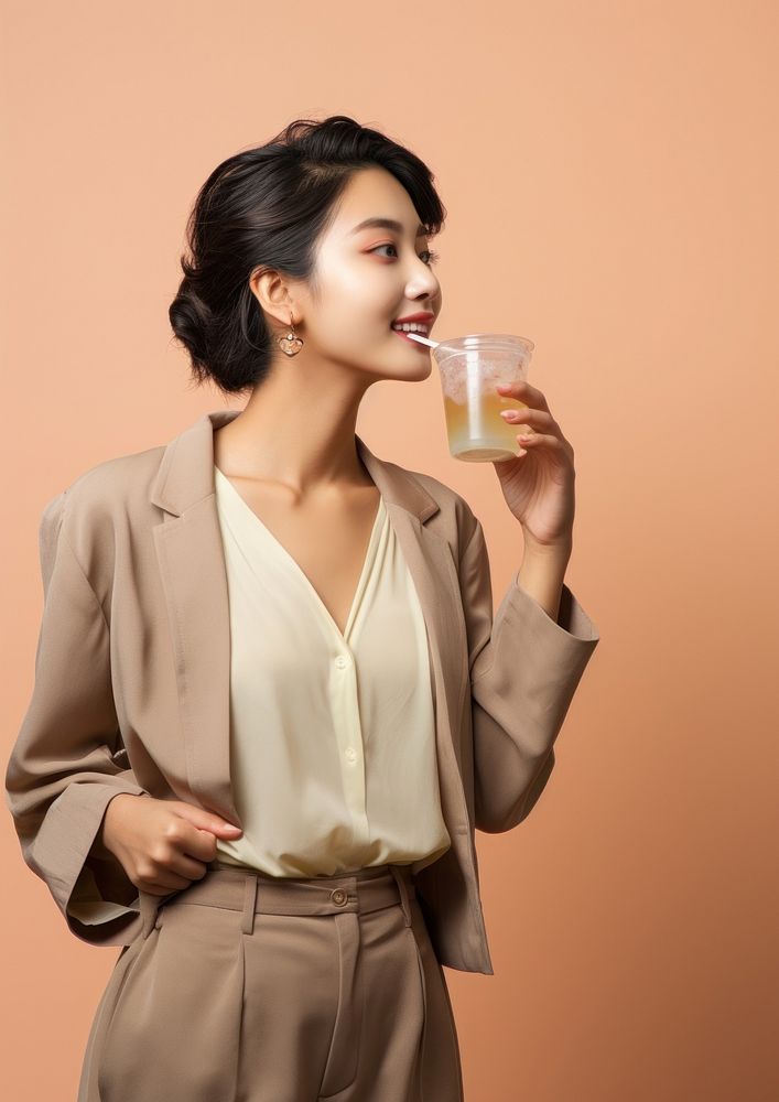 An Asian woman drinking boba | Free Photo - rawpixel