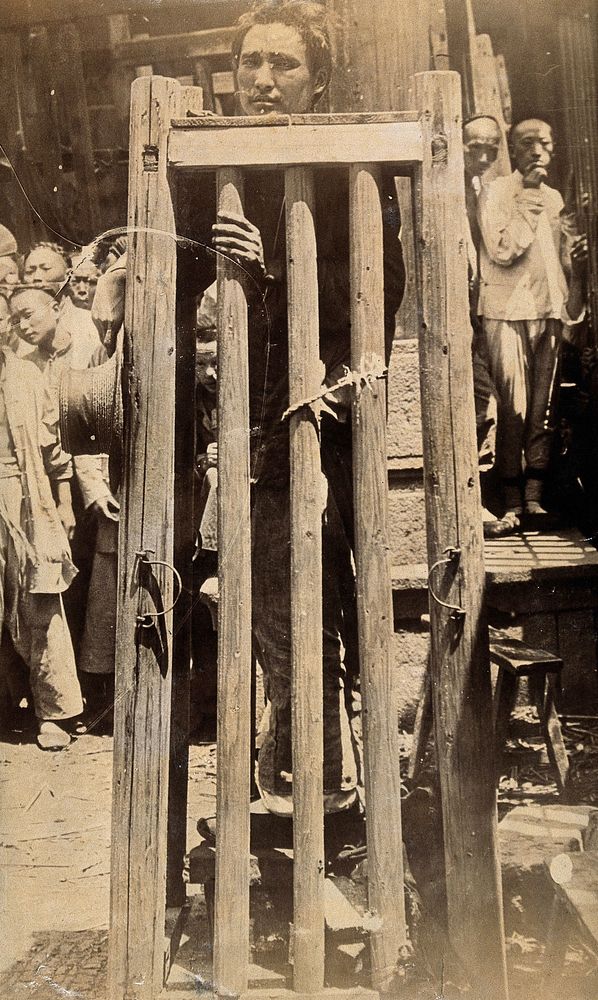 China: man standing locked cage | Free Photo - rawpixel