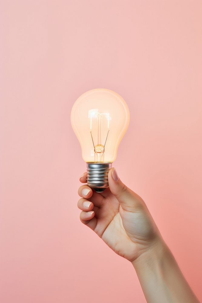 Hand holding little light bulb | Premium Photo - rawpixel