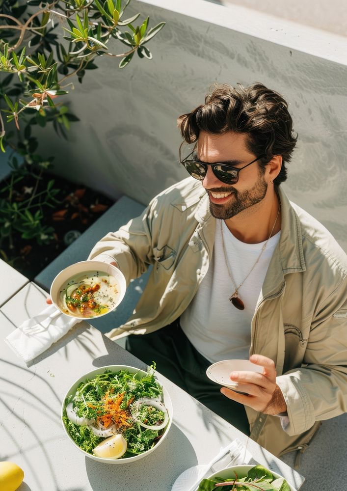 happy man eating lunch table | Free Photo - rawpixel