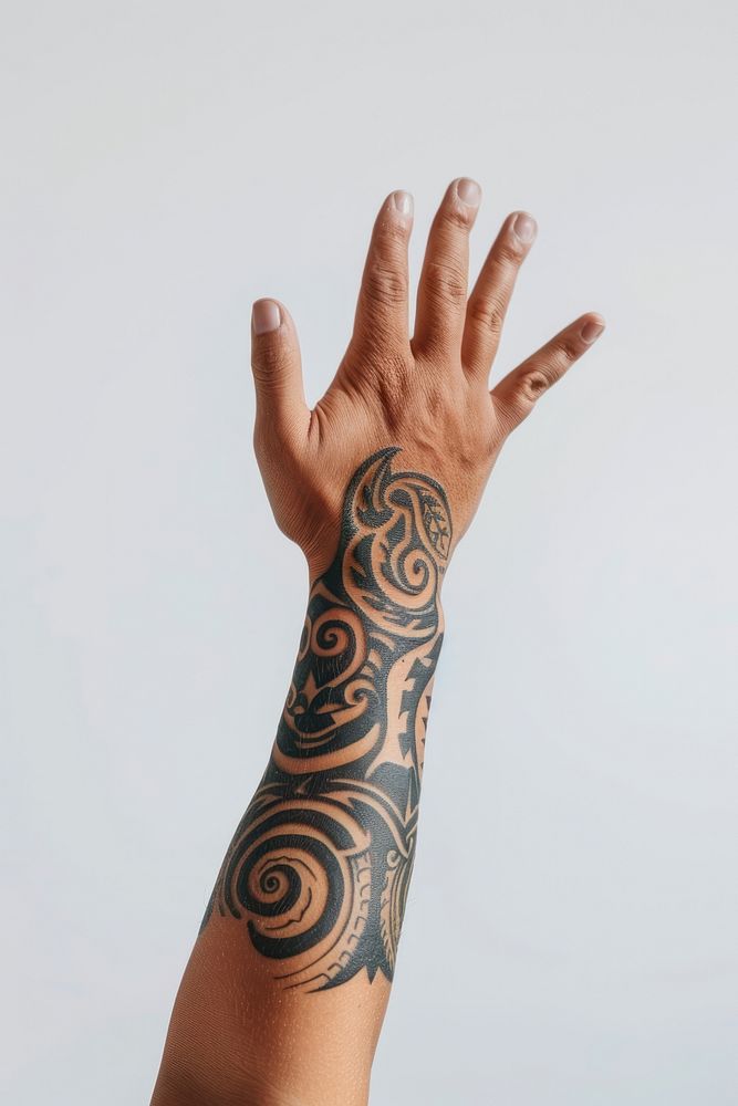 Hand holding Maori tattoo person | Free Photo - rawpixel