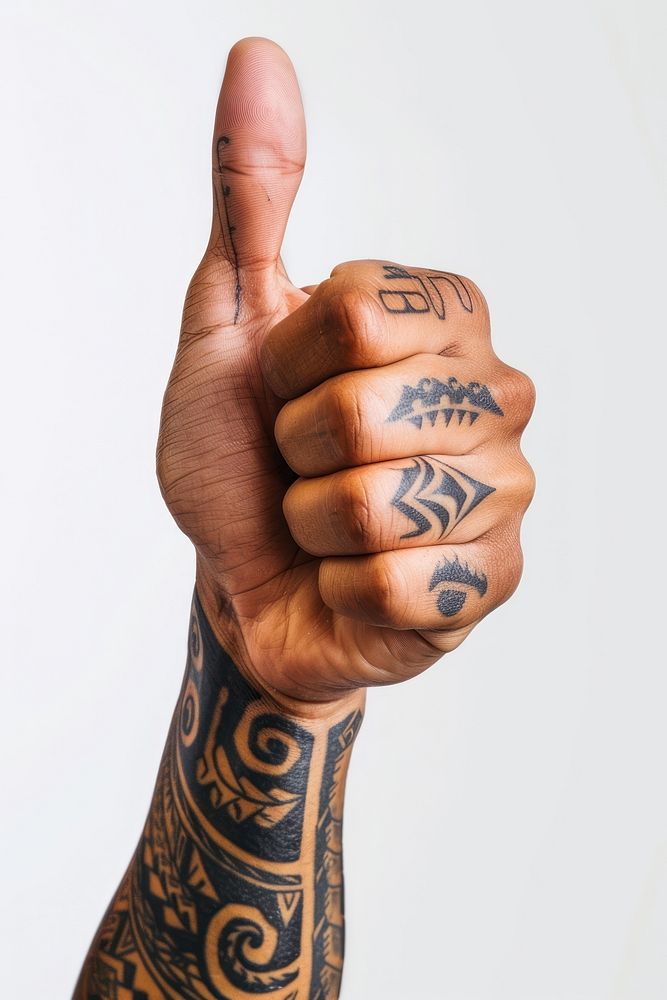 Hand holding Maori tattoo giving | Free Photo - rawpixel
