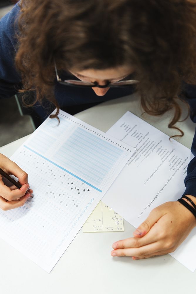Person taking test, focused filling | Premium Photo - rawpixel