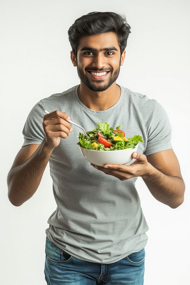 Smiling Indian male model eating | Free Photo - rawpixel