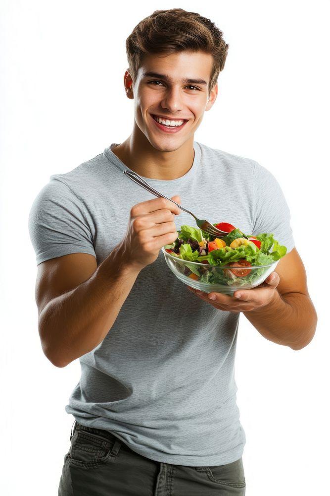 Smiling male model eating salad | Free Photo - rawpixel