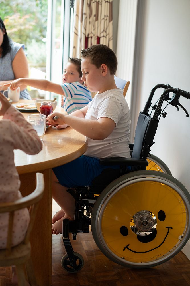 Young boy wheelchair smiley face | Free Photo - rawpixel