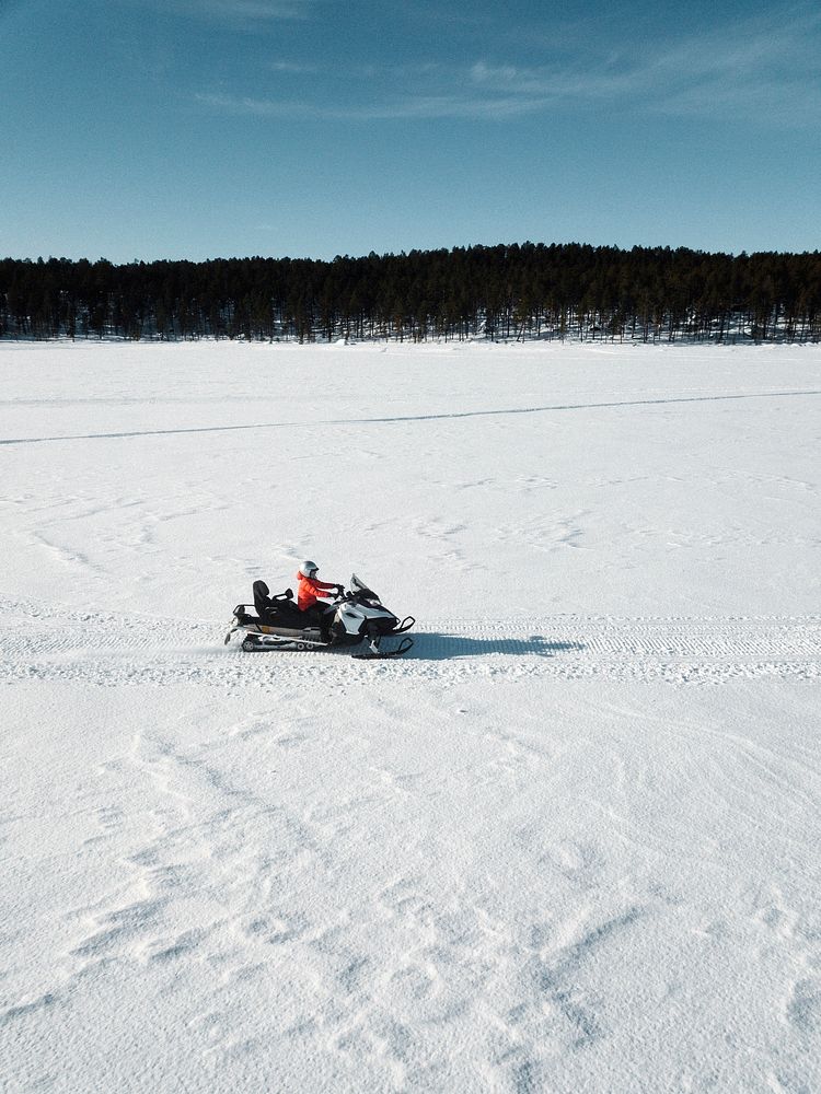 Man riding motor sled snowy | Free Photo - rawpixel