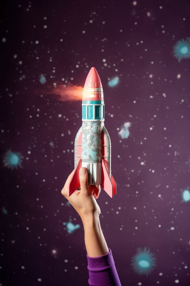 Hand holding toy rocket exploration | Free Photo - rawpixel