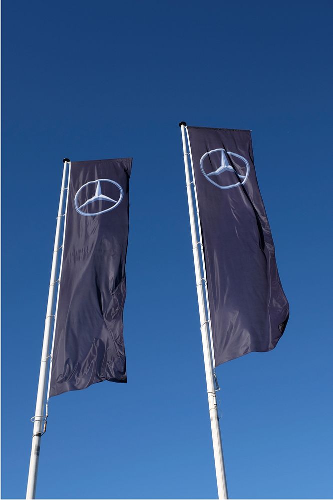 Mercedes-Benz logo on flags, location | Free Photo - rawpixel