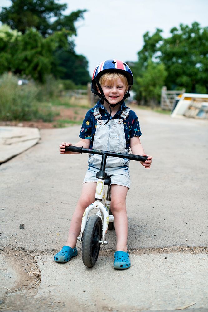 young boy riding his bike | Free Photo - rawpixel
