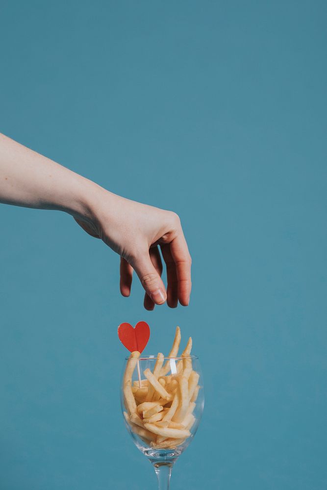 Woman picking french fries wine | Premium Photo - rawpixel