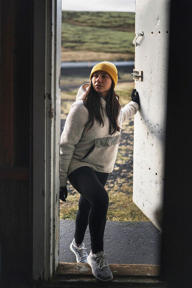 Woman walking into a house | Premium Photo - rawpixel