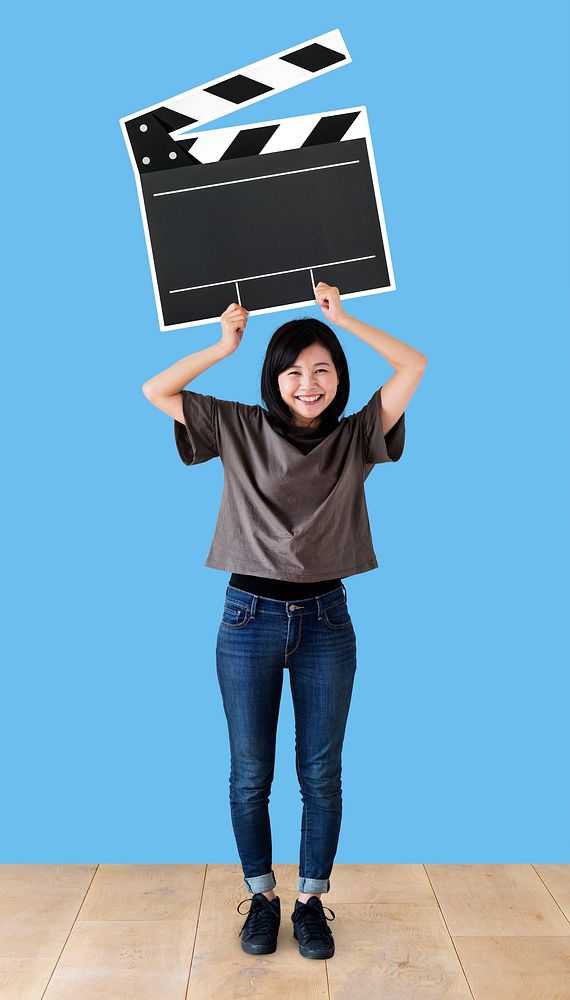 Woman holding clapper studio | Premium Photo - rawpixel