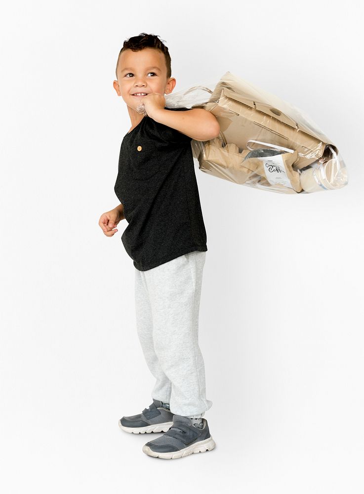 Young boy standing and holding | Free Photo - rawpixel