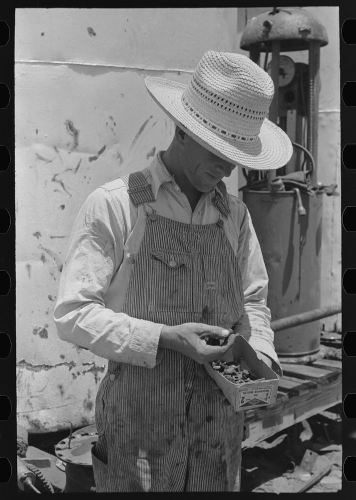 Day laborer looking box nuts | Free Photo - rawpixel
