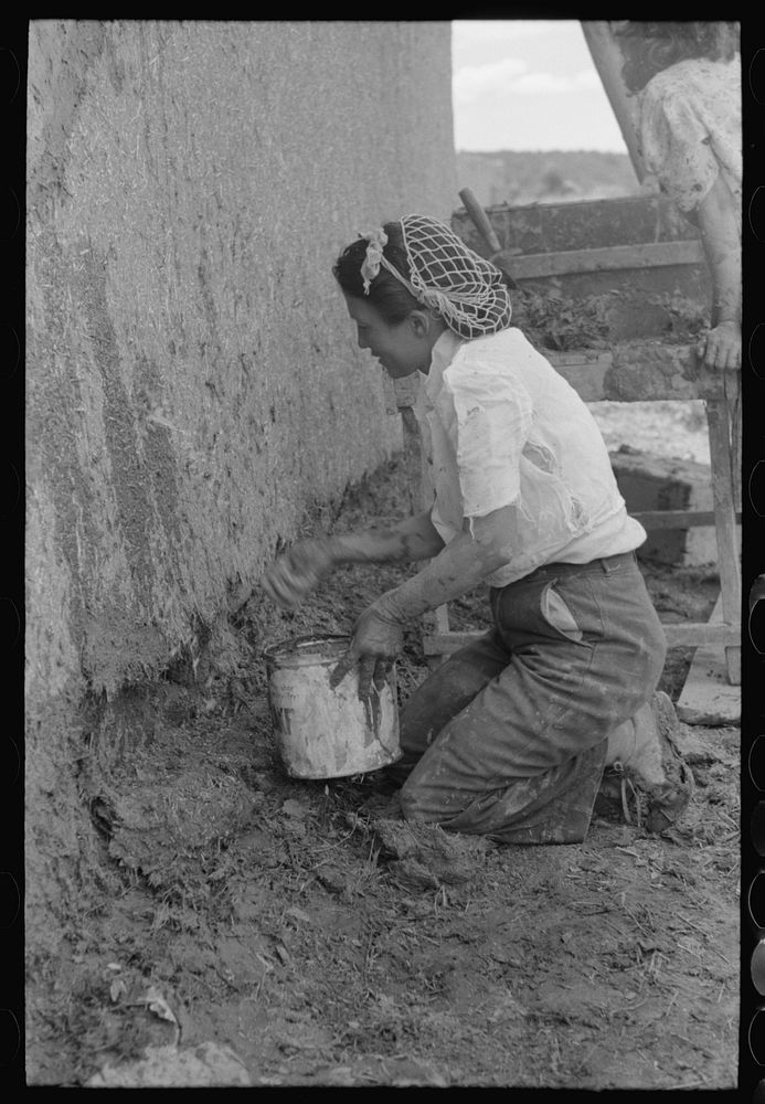 Spanish-American women plastering an adobe | Free Photo - rawpixel