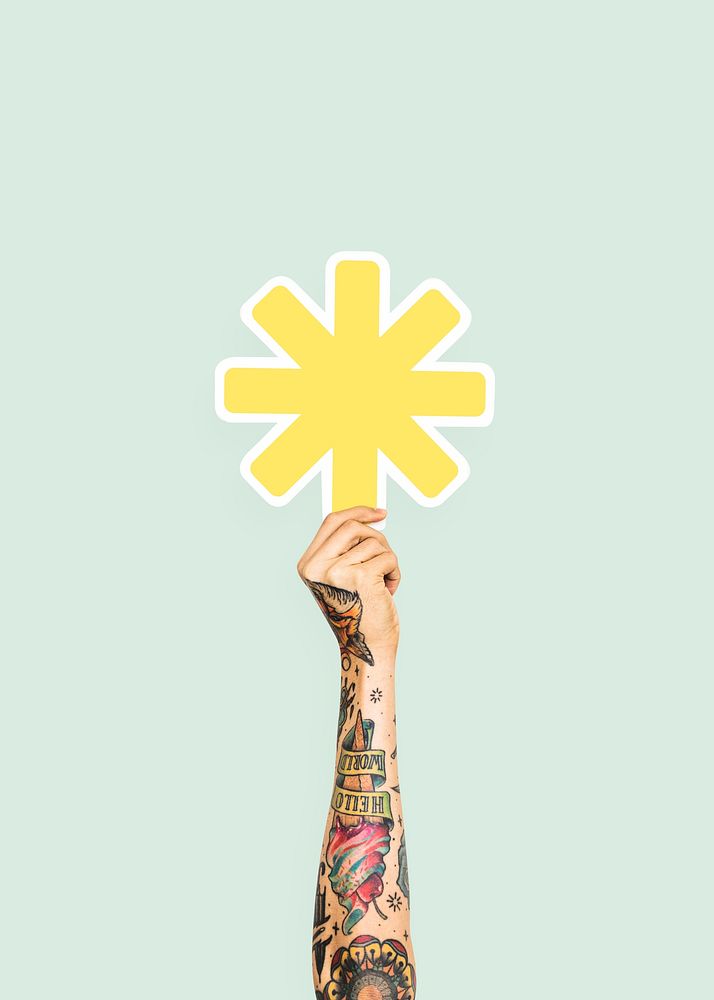 Hand holding an asterisk sign | Premium PSD - rawpixel