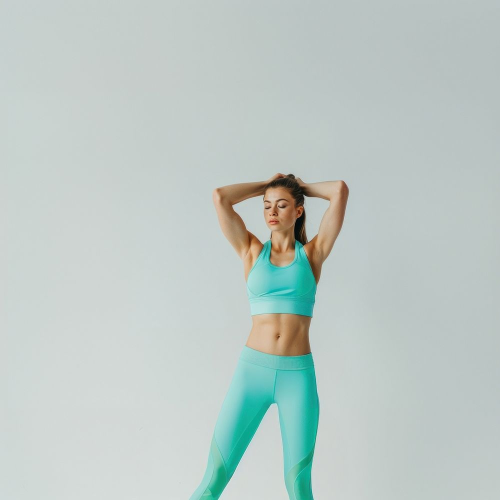 Woman in teal workout attire | Free Photo - rawpixel