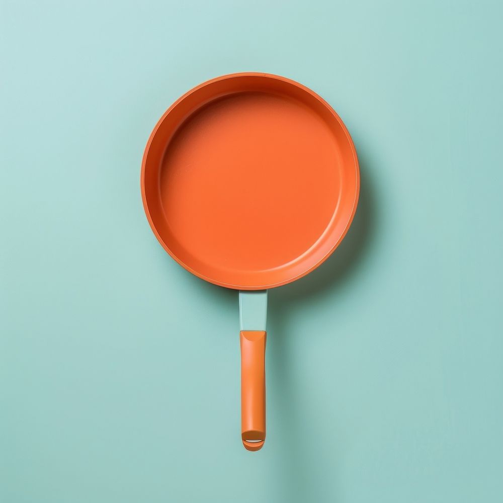 Orange frying pan teal background | Free Photo - rawpixel