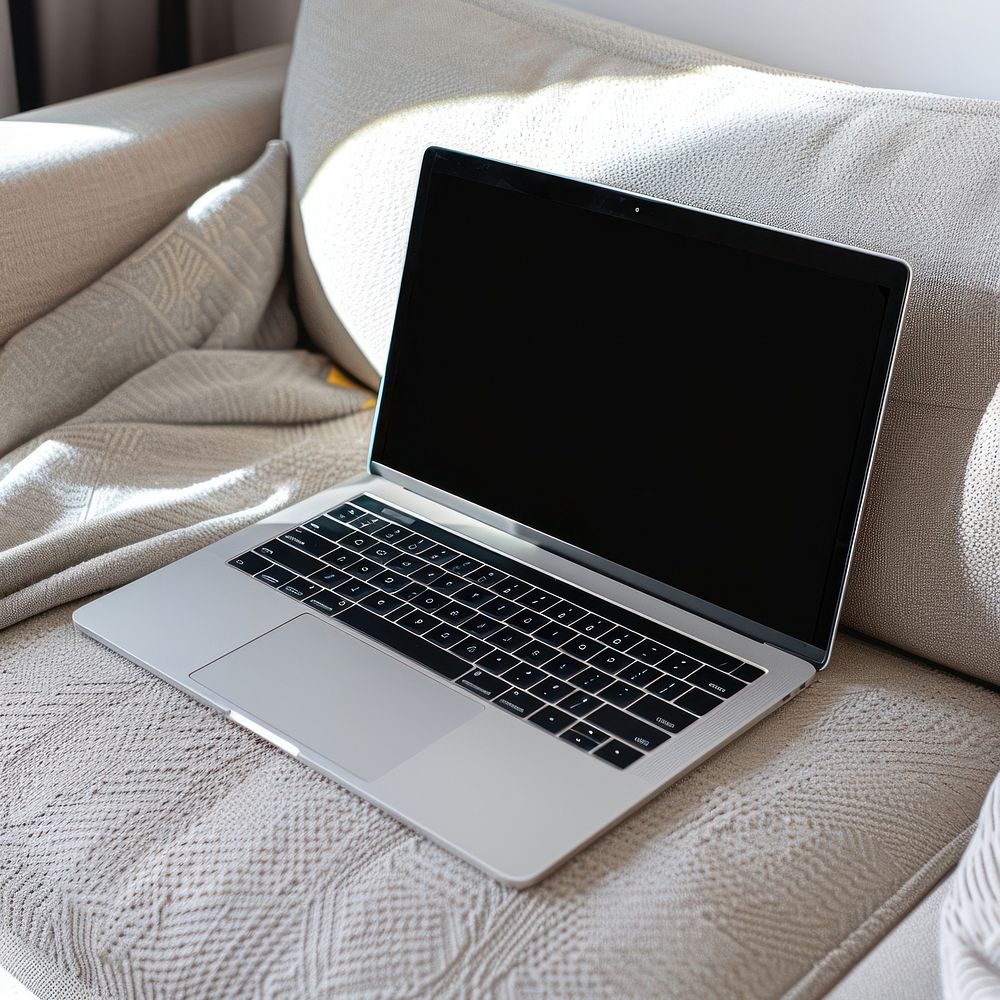 Laptop on cozy sofa | Free Photo - rawpixel