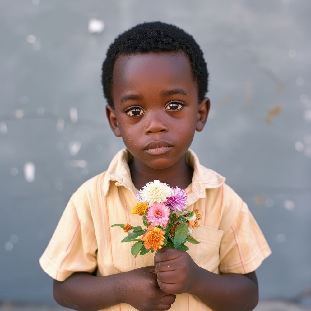 little boy holding flowers portrait | Free Photo - rawpixel
