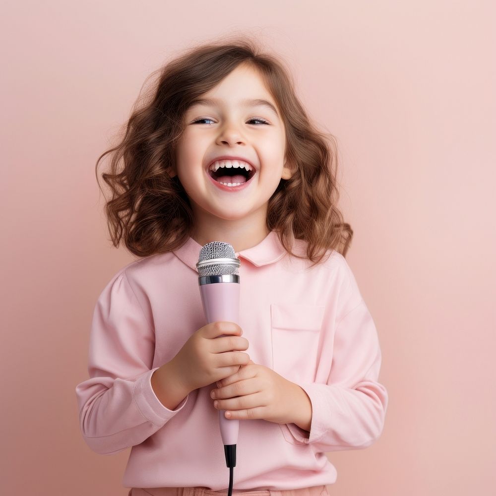 Girl holding microphone laughing portrait | Free Photo - rawpixel