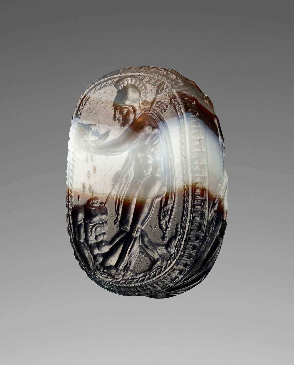 Engraved Scarab Warrior Holding Head | Free Photo - rawpixel