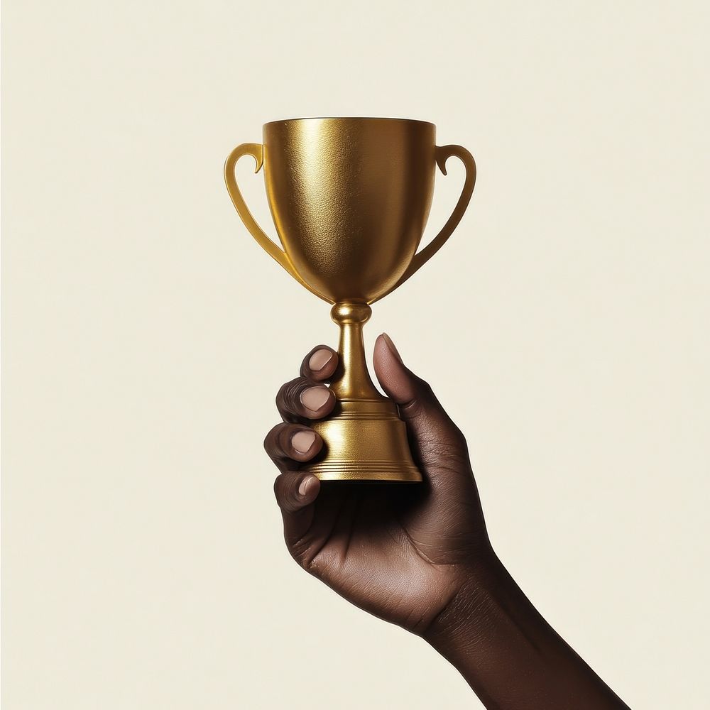 Trophy holding gold hand. | Free Photo - rawpixel