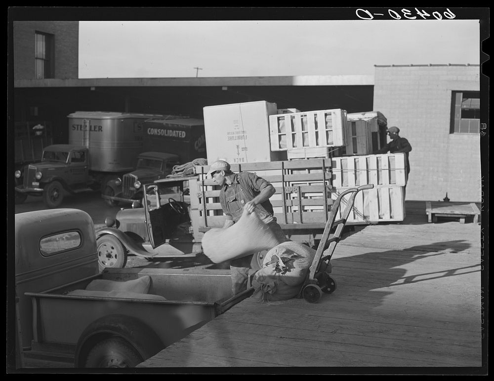 Loading trucks sacks salt. Minneapolis, | Free Photo - rawpixel