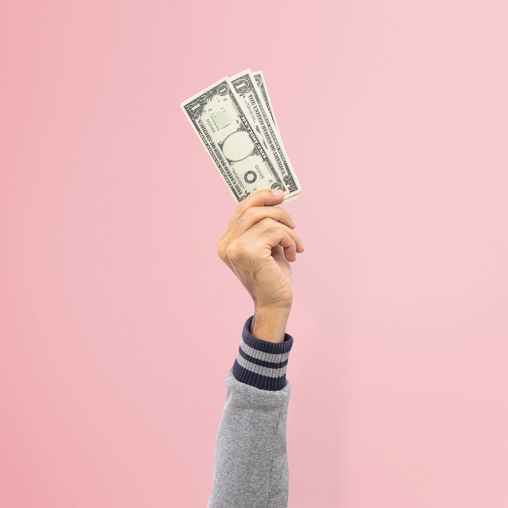 Hand holding money finance concept | Free Photo - rawpixel