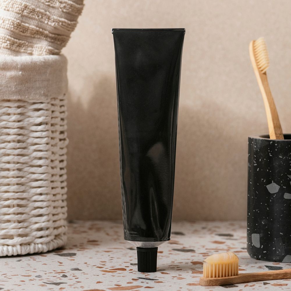 Black toothpaste tube, aluminium collapsible | Free Photo - rawpixel