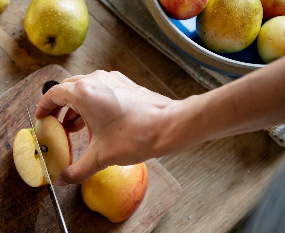 Closeup of apples being cut | Premium Photo - rawpixel