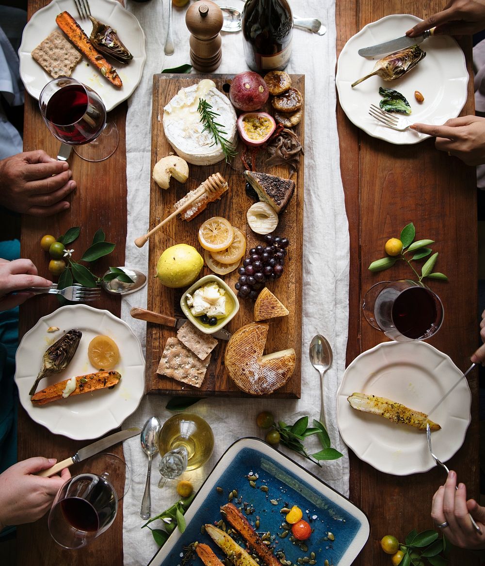 Adults eating a cheese platter | Premium Photo - rawpixel