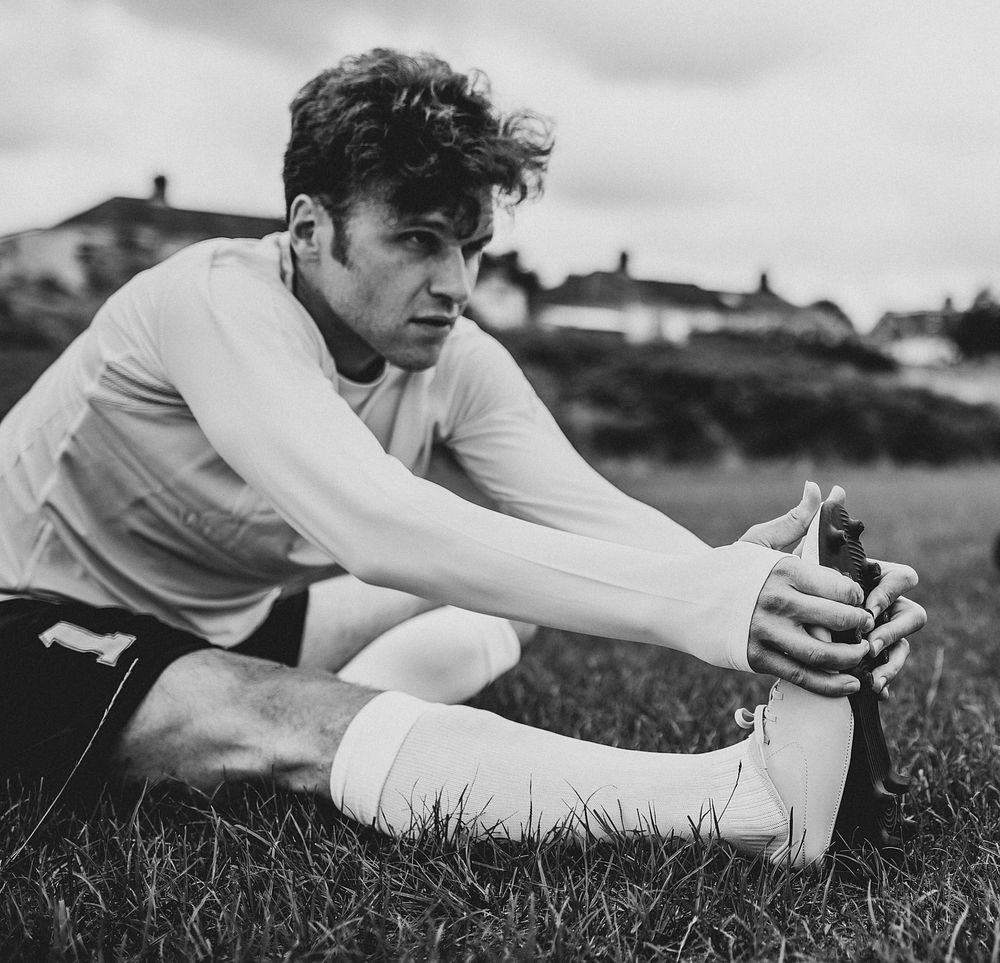 Football player stretching match | Premium Photo - rawpixel