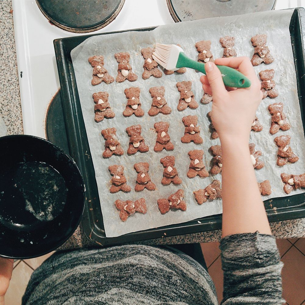 Preparing Christmas gingerbread bears almonds | Free Photo - rawpixel