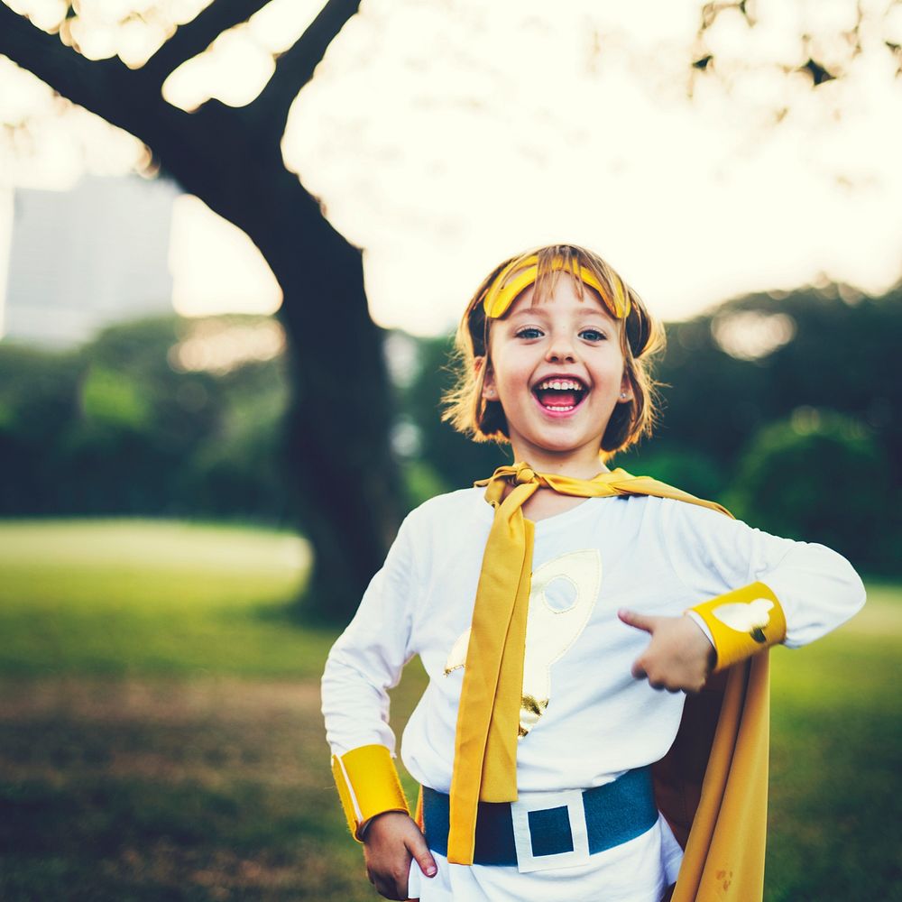 Cute superhero girl at the park | Free Photo - rawpixel