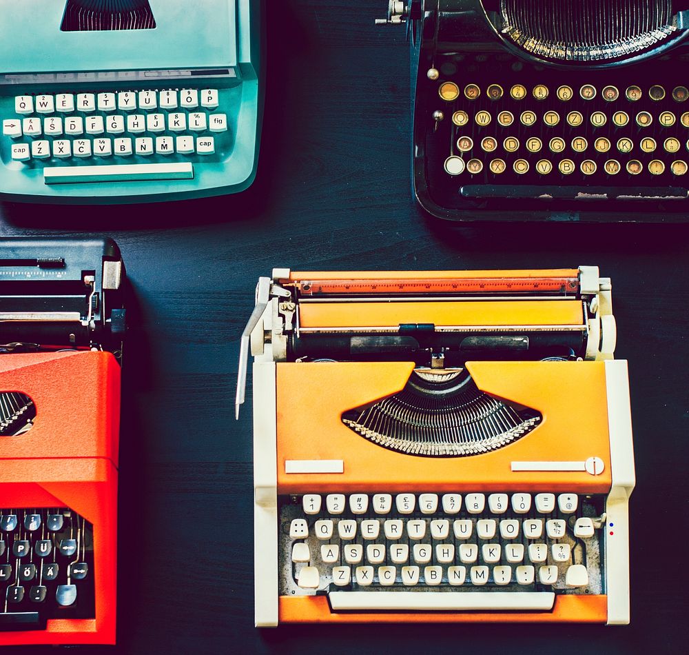 Colorful vintage typewriters table | Premium Photo - rawpixel