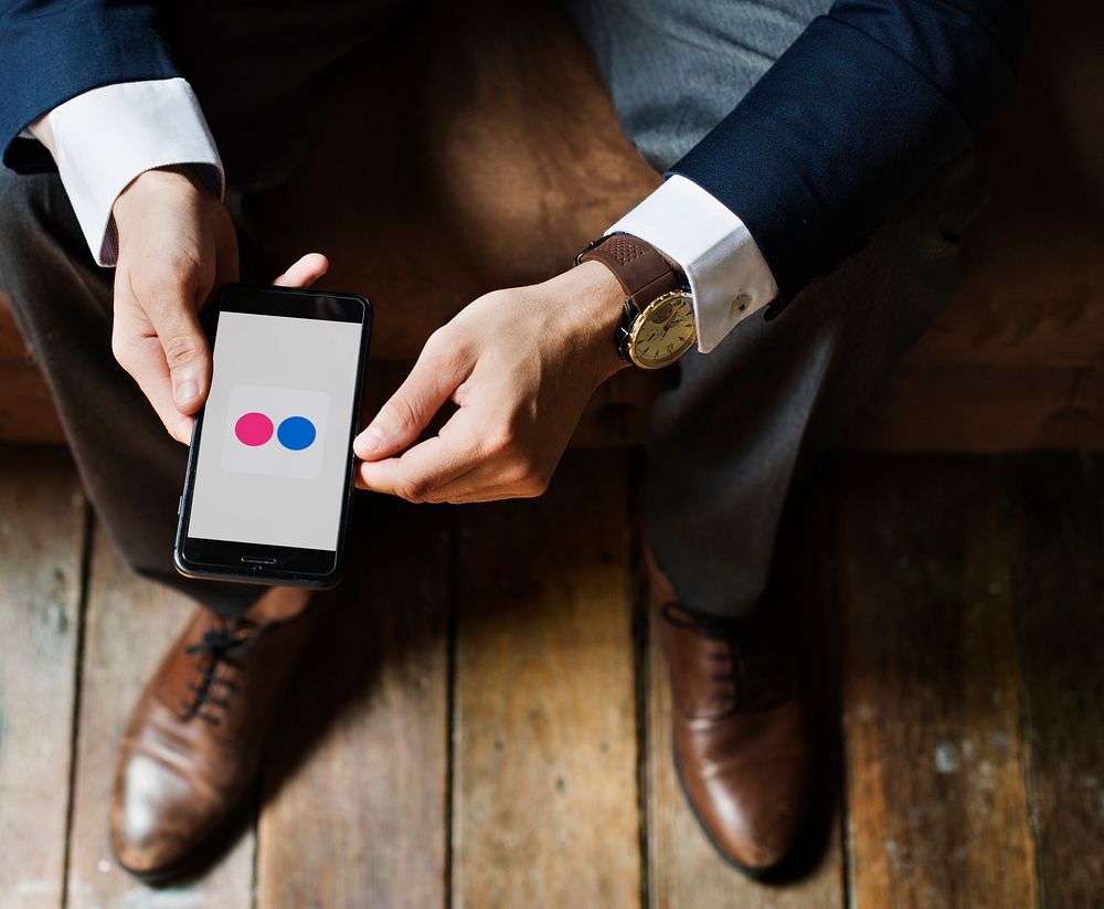 Businessman using Flickr phone. BANGKOK, | Free Photo - rawpixel